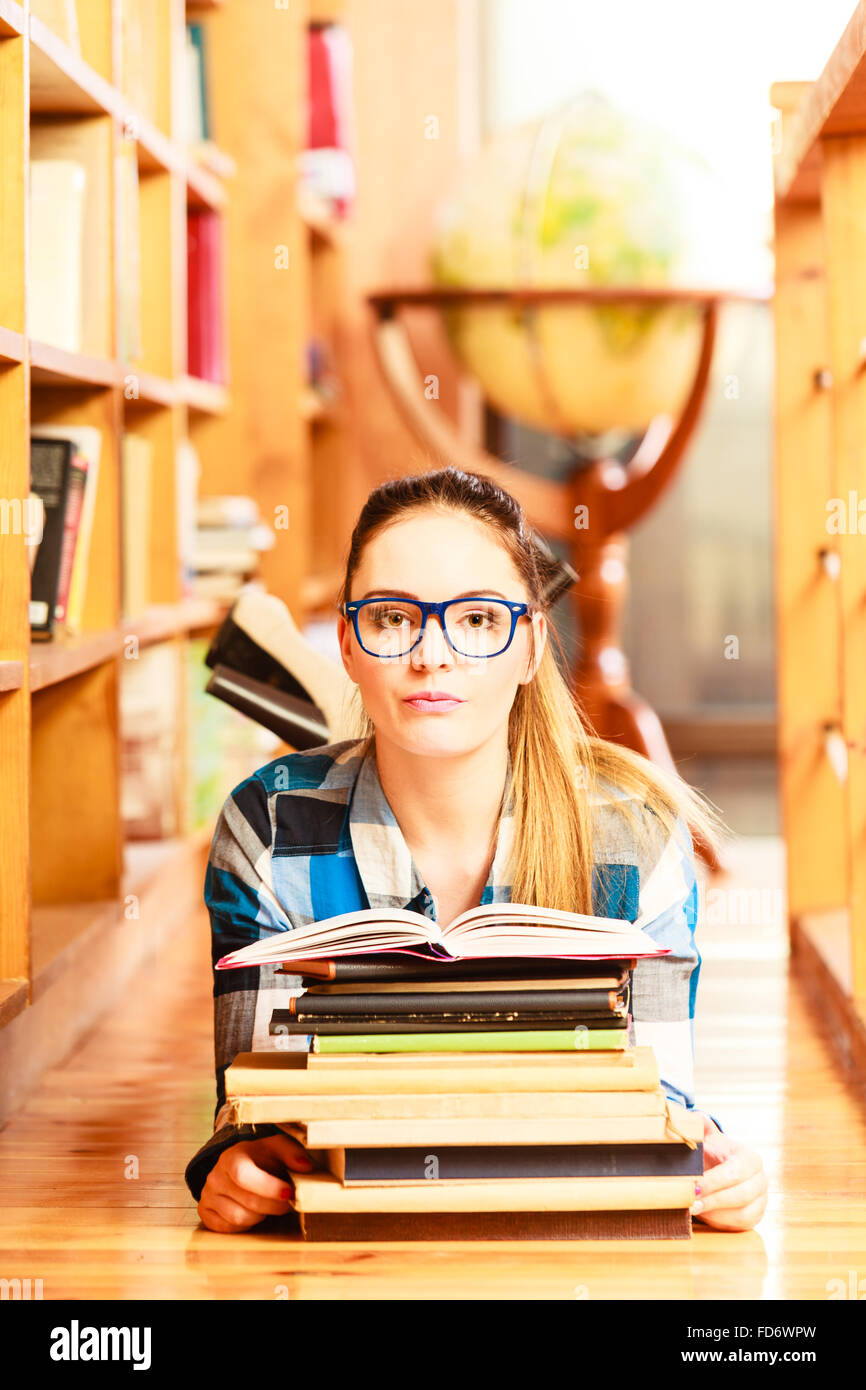 Education school concept. Clever female student girl in blue glasses ...