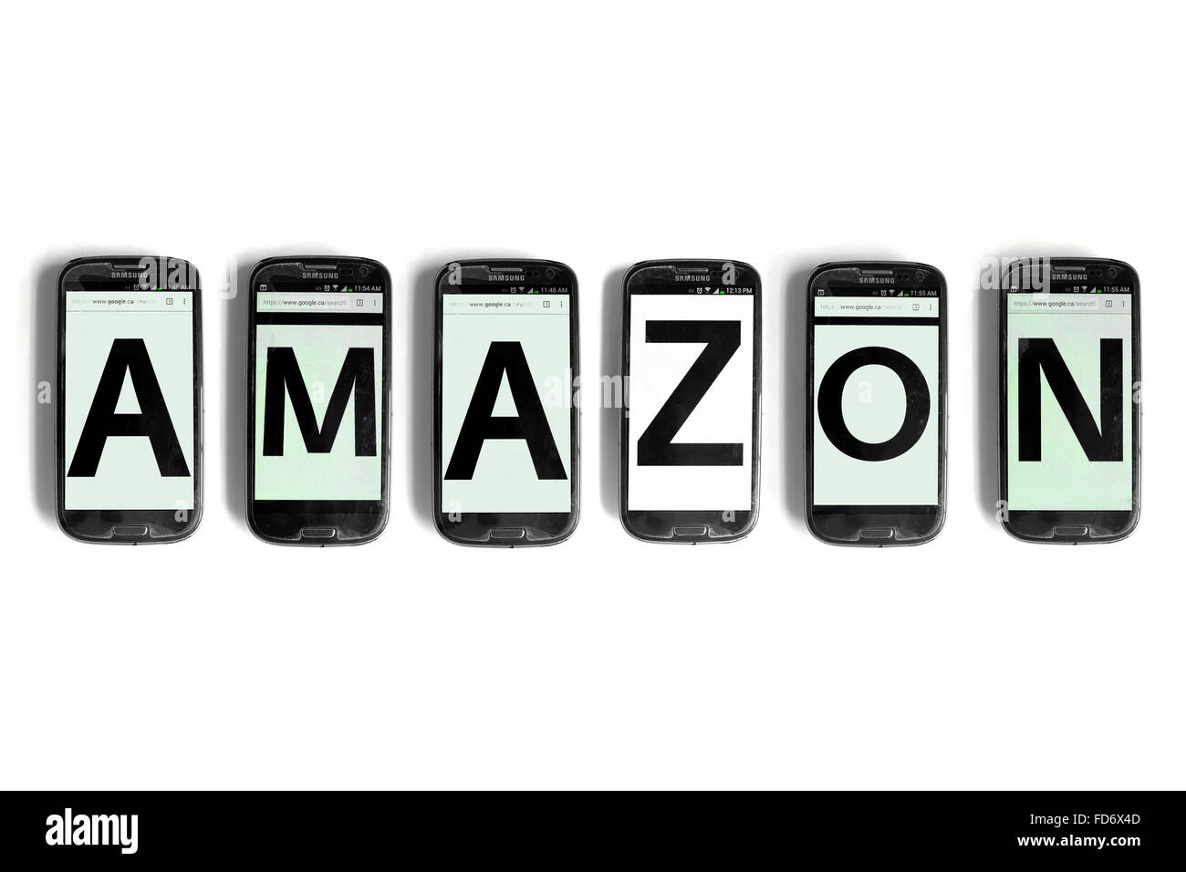 Amazon spelled on the screens of smartphones photographed against a ...