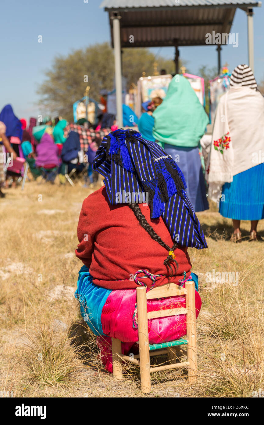 Indigenous pilgrims listen to an outdoor mass on the pilgrimage route ...