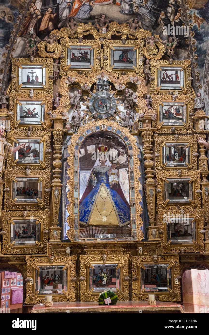 Ornate Mexican folk Baroque altar with the Virgin of Sorrows at the ...