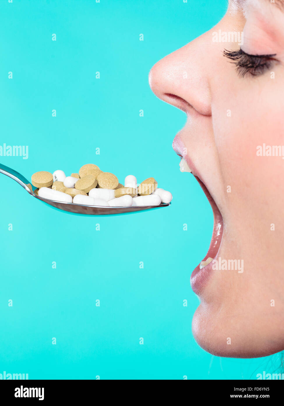 Swallow tablets woman hi-res stock photography and images - Alamy