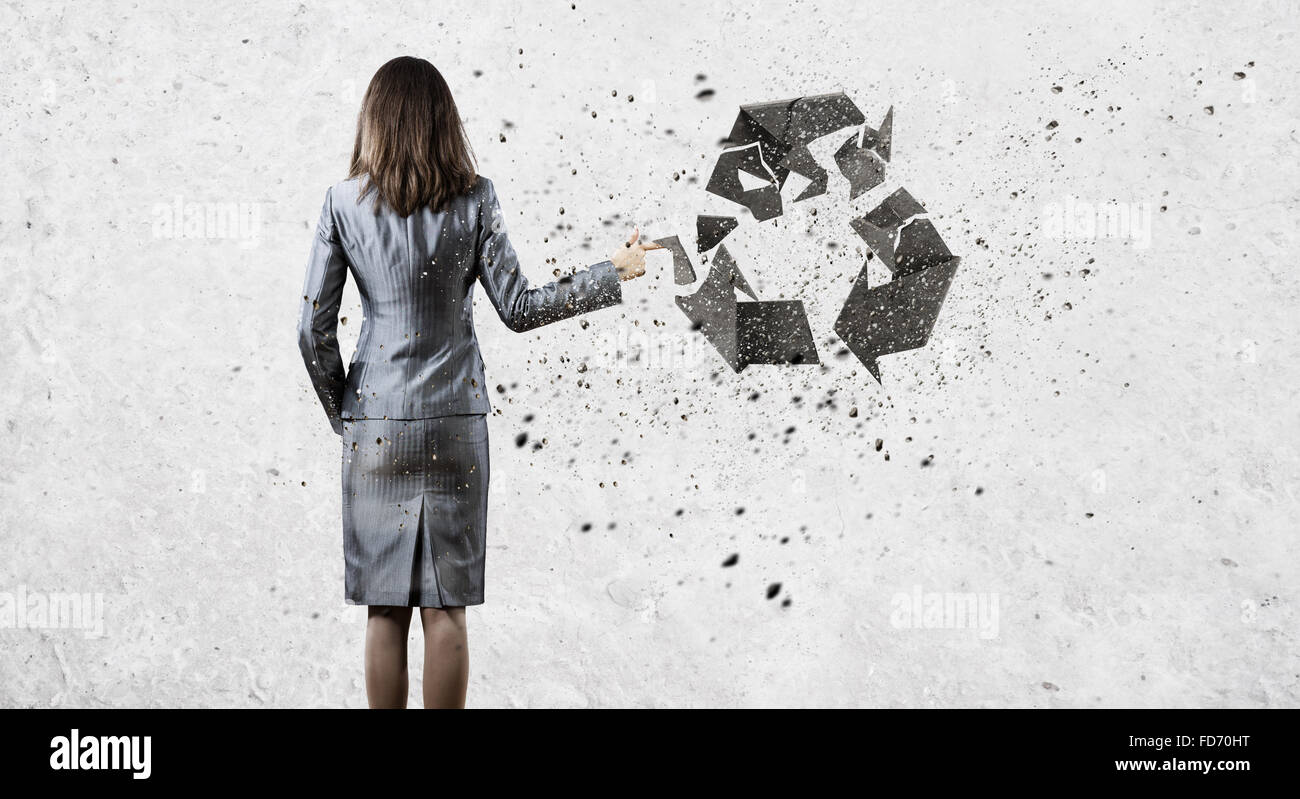 Back view of businesswoman with stone recycle symbol Stock Photo - Alamy