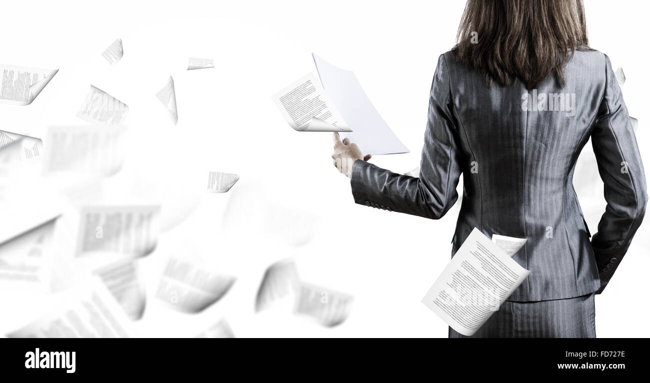 Back view of businesswoman holding papers in hands Stock Photo - Alamy