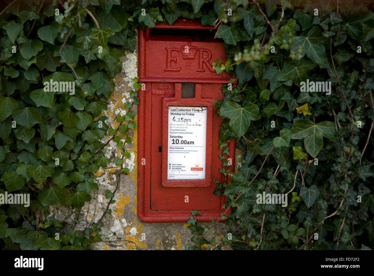 Ivy grows over a wall next to a post box in the hamlet of Bohortha, in ...