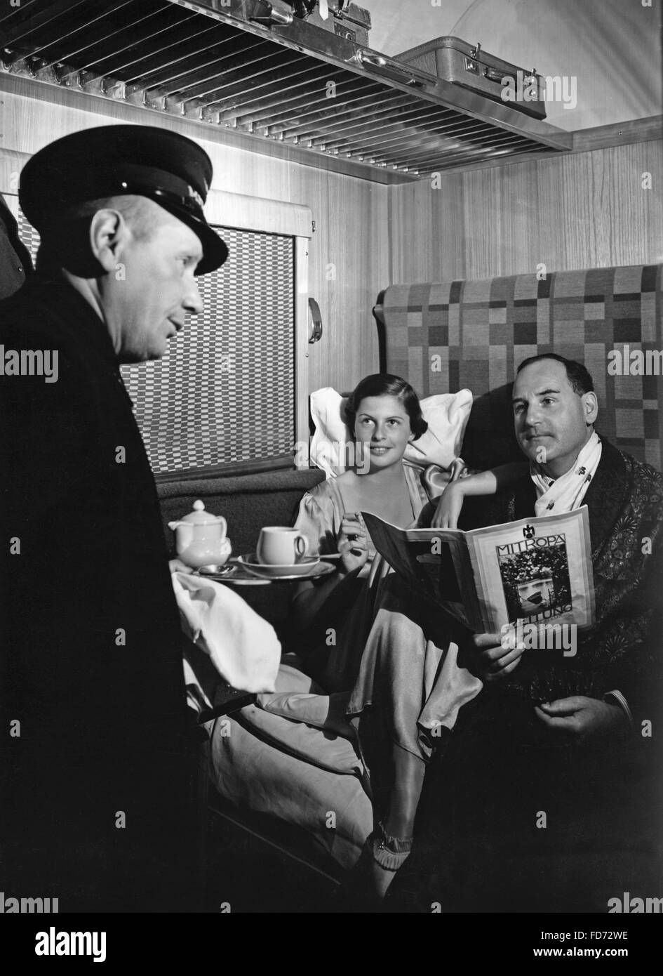 Train passengers, 1935 Stock Photo - Alamy