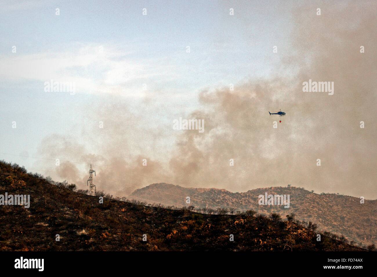 Helicopter flying over mountains hi-res stock photography and images ...