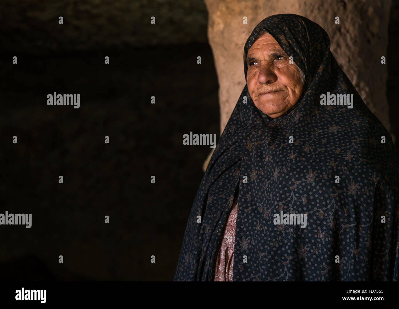old widow woman inside the mosque of the troglodyte village, Kerman ...