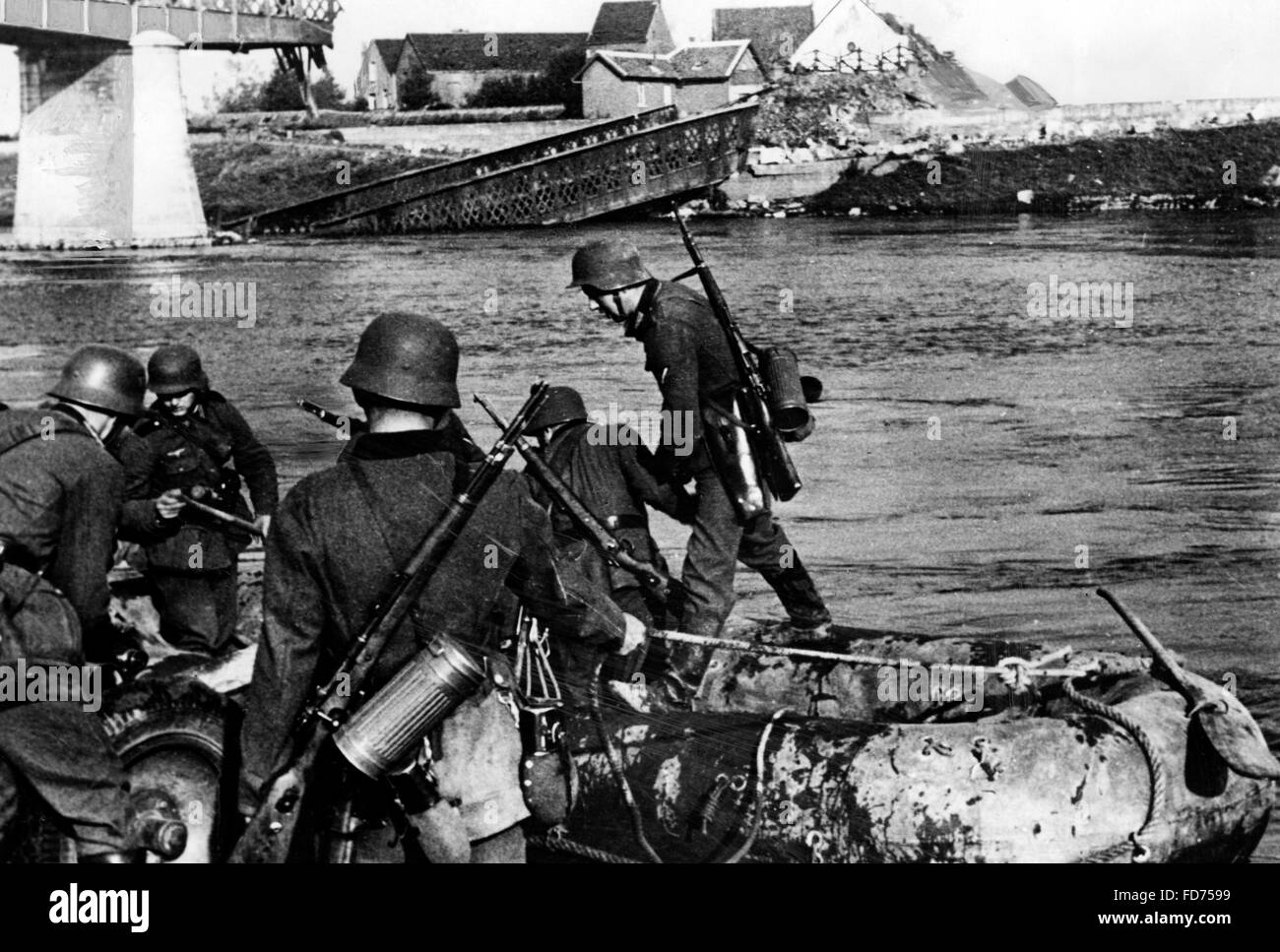 German soldiers and a bridge destroyed by the Dutch, 1940 Stock Photo ...