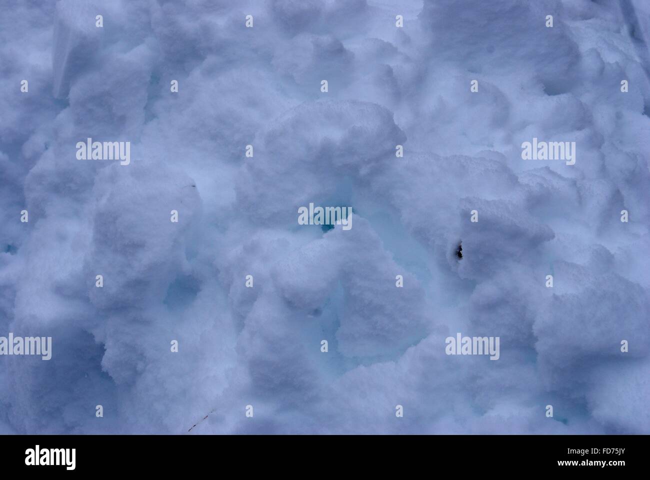 A beautiful photo of a little snow crevice in a snow bank Stock Photo ...