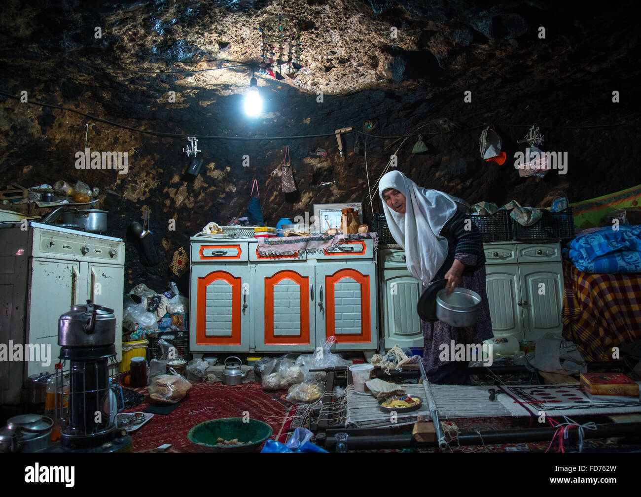old widow woman in her troglodyte house, Kerman province, Meymand, Iran ...