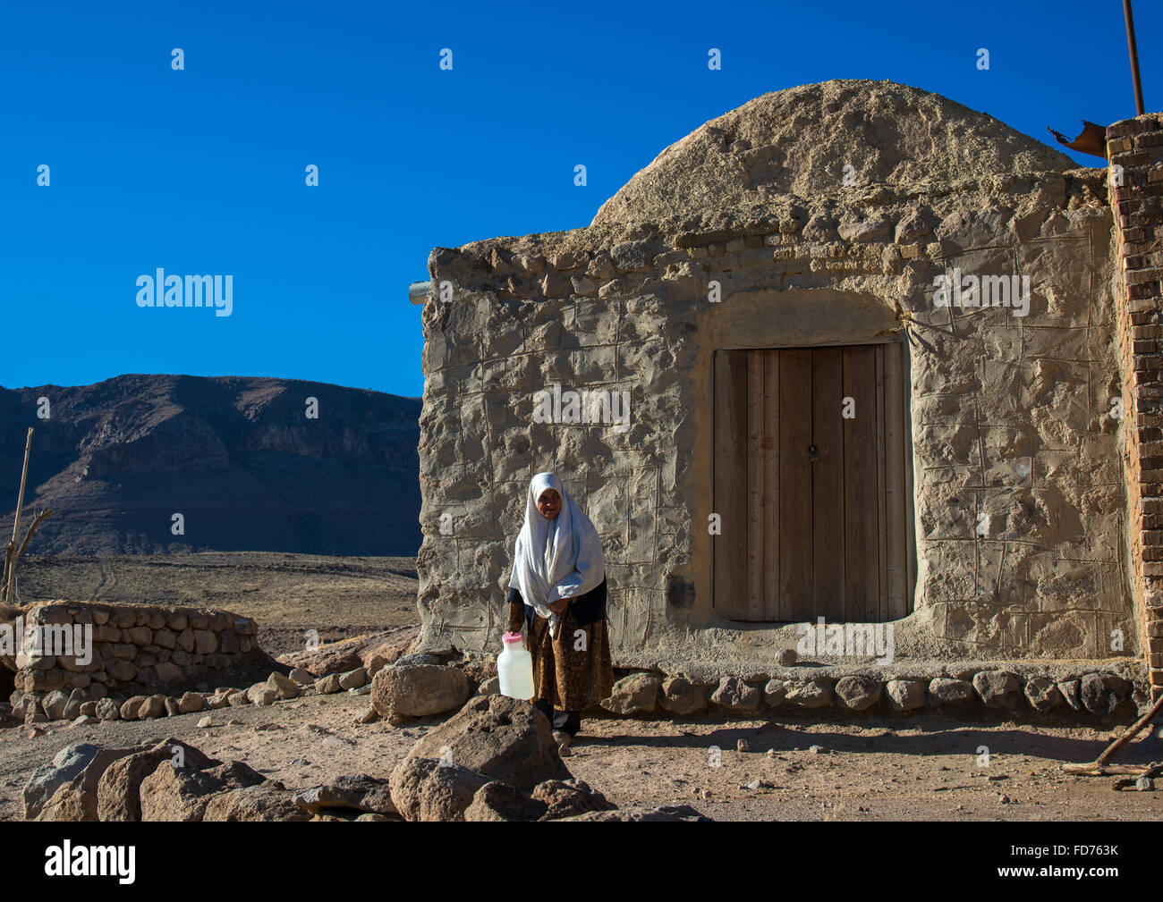 old widow woman in the troglodyte village, Kerman province, Meymand ...