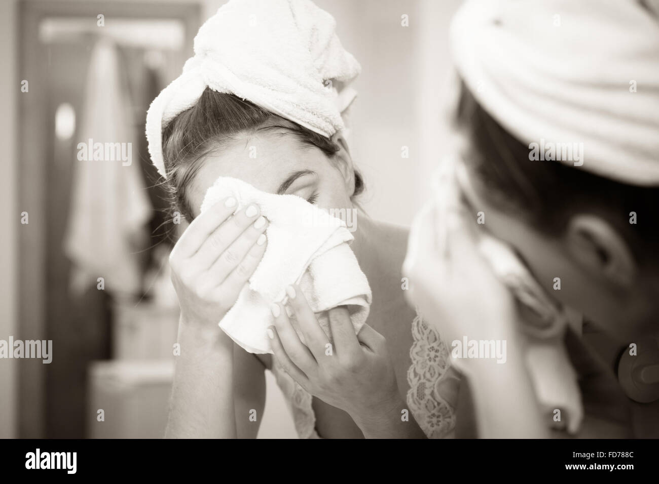 Woman cleaning washing her face with clean water in bathroom. Girl ...