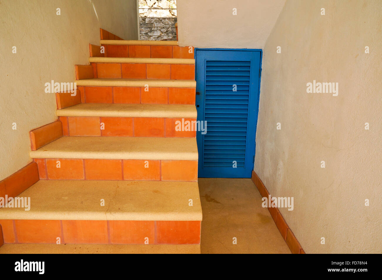 Blue painted door and clay stairs in home in Mexico Stock Photo - Alamy