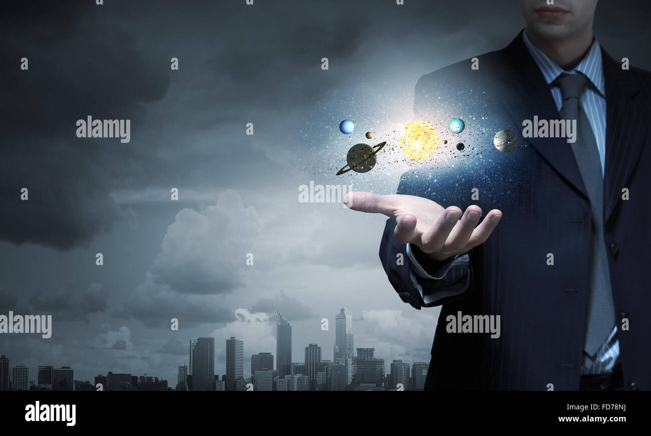 Close up of human hand with planets of sun system Stock Photo - Alamy