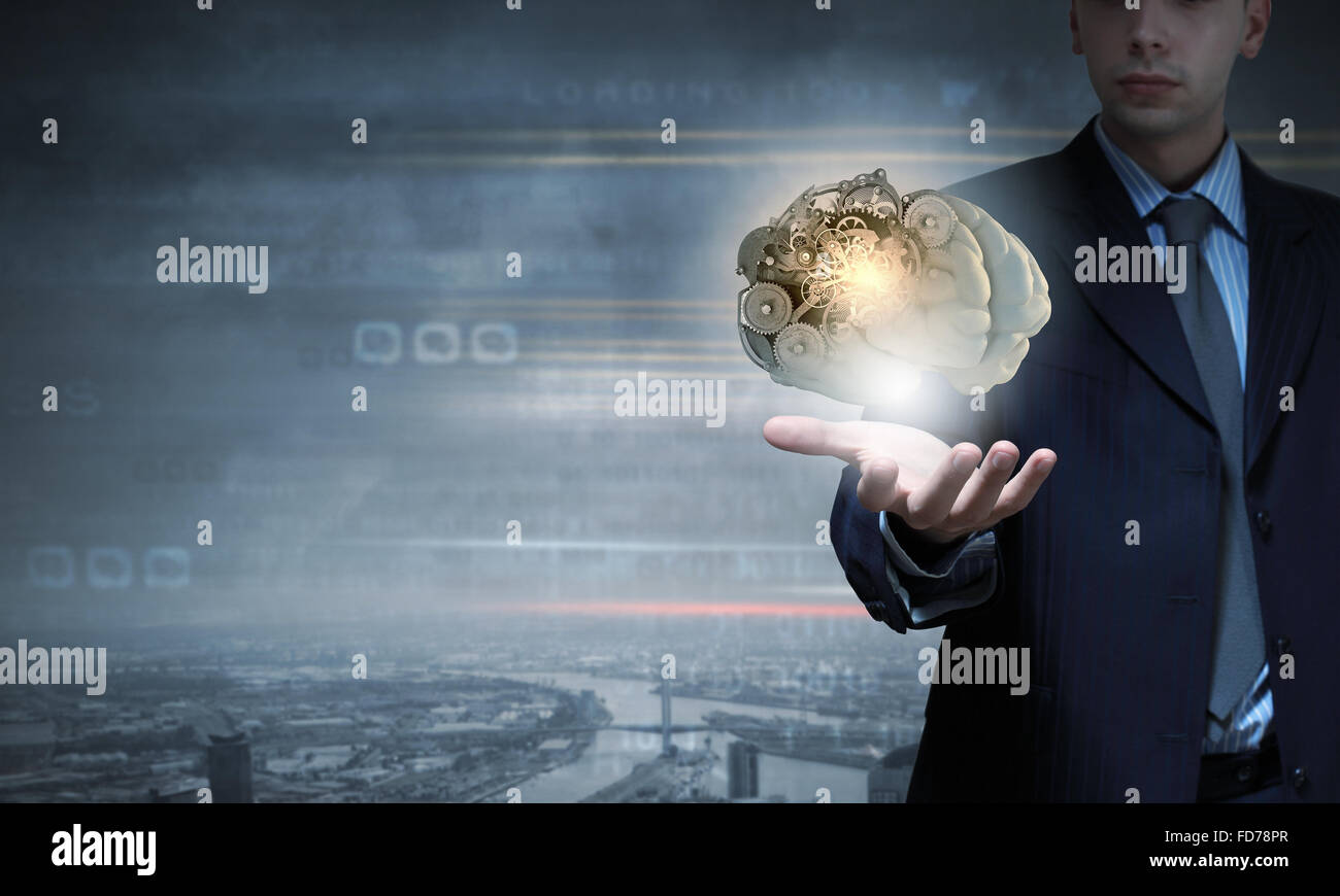 Close up of businessman holding human brain in hand Stock Photo - Alamy