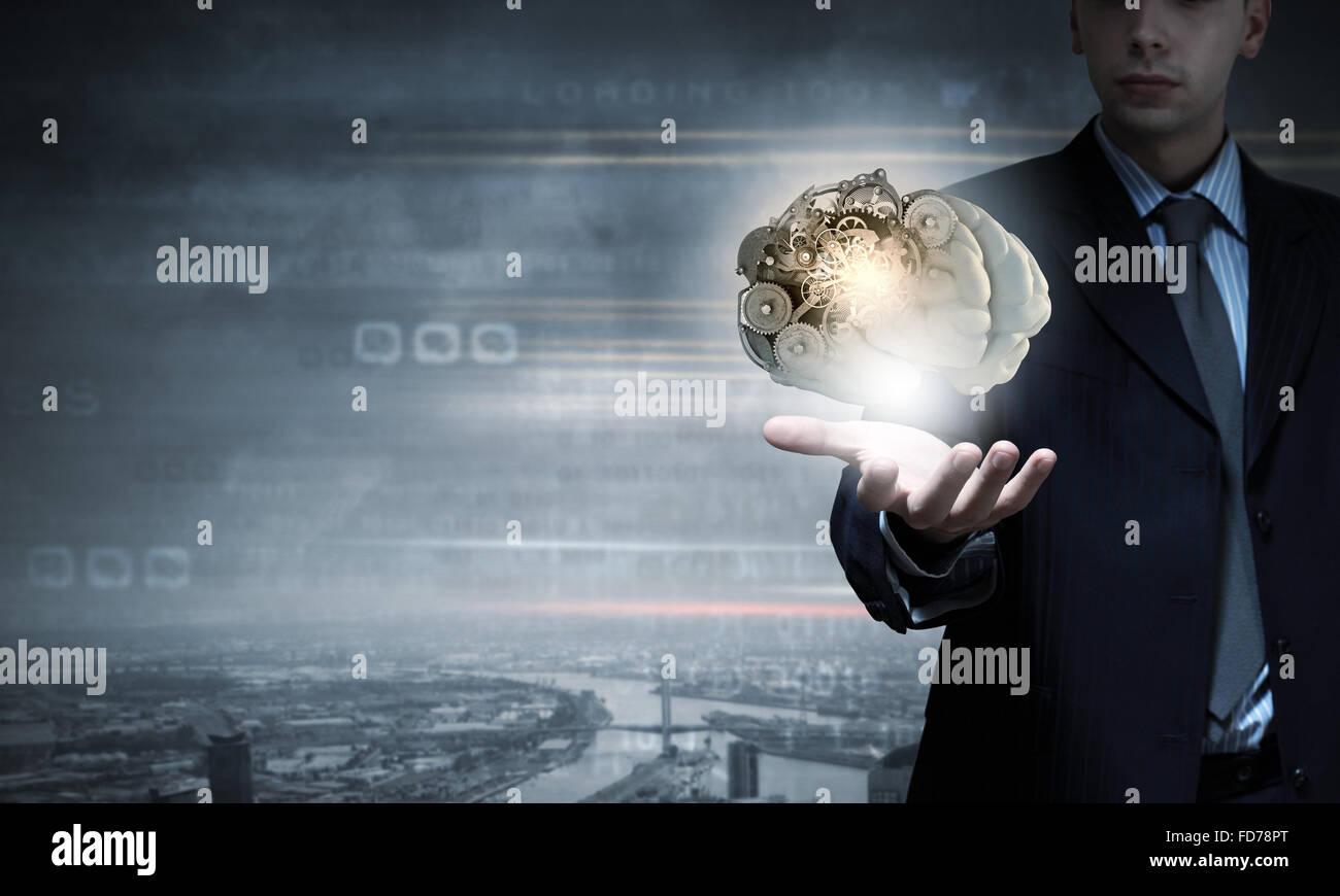 Businessman holding gear wheel hi-res stock photography and images - Alamy