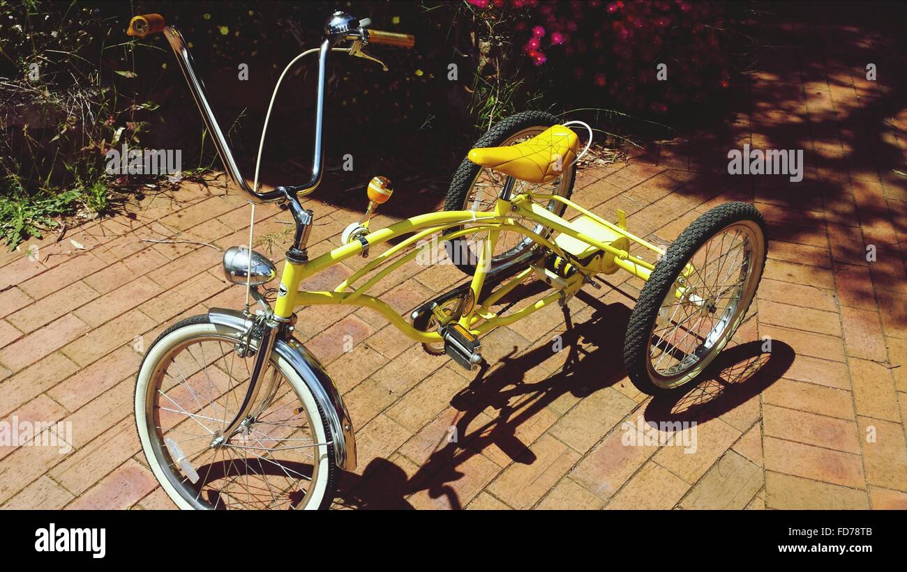 Yellow tricycle hi-res stock photography and images - Alamy