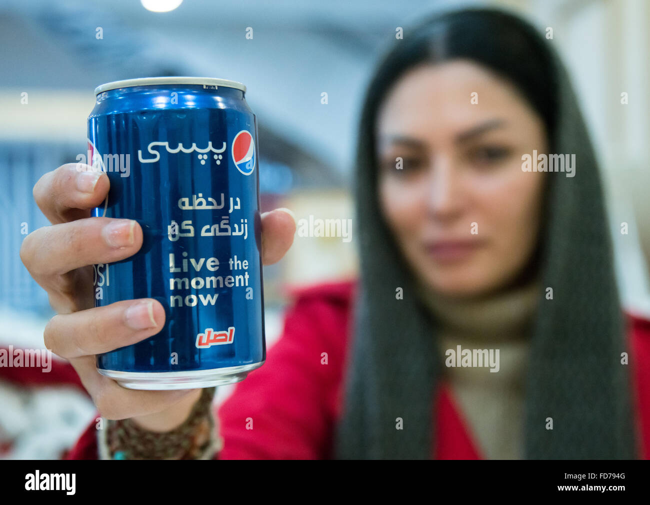 iranian woman showing a pepsi can with persian script, Isfahan Province ...