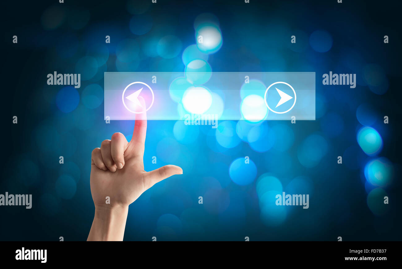 Close up of hand pushing icon of media player Stock Photo - Alamy