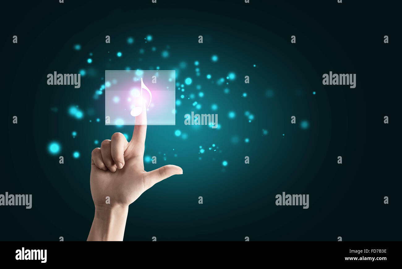 Close up of hand pushing icon of media player Stock Photo - Alamy
