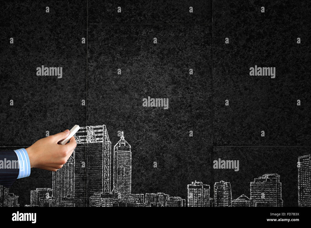 Close up of hand drawing urban city building on chalk board Stock Photo ...