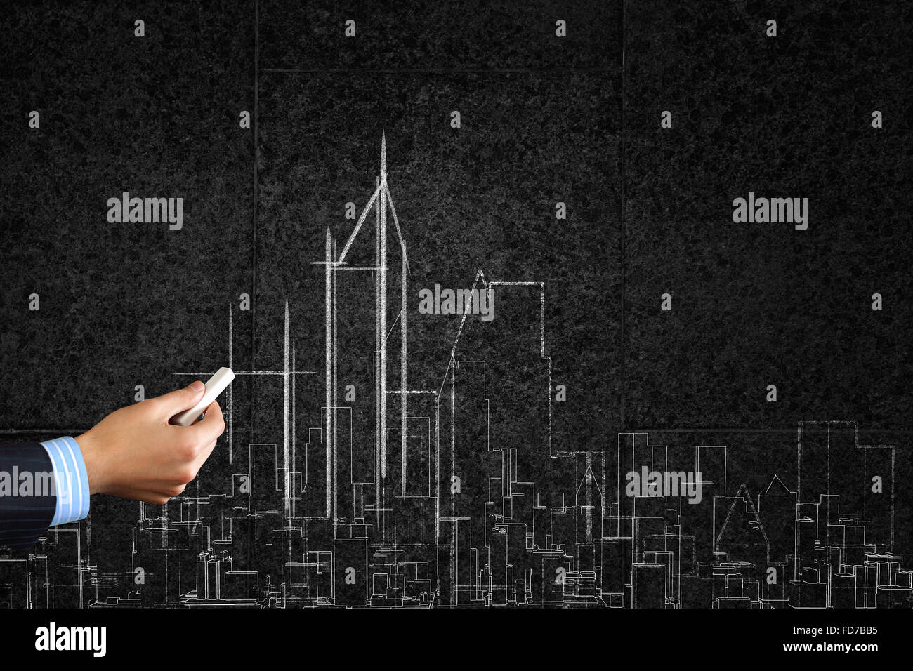 Close up of hand drawing urban city building on chalk board Stock Photo ...