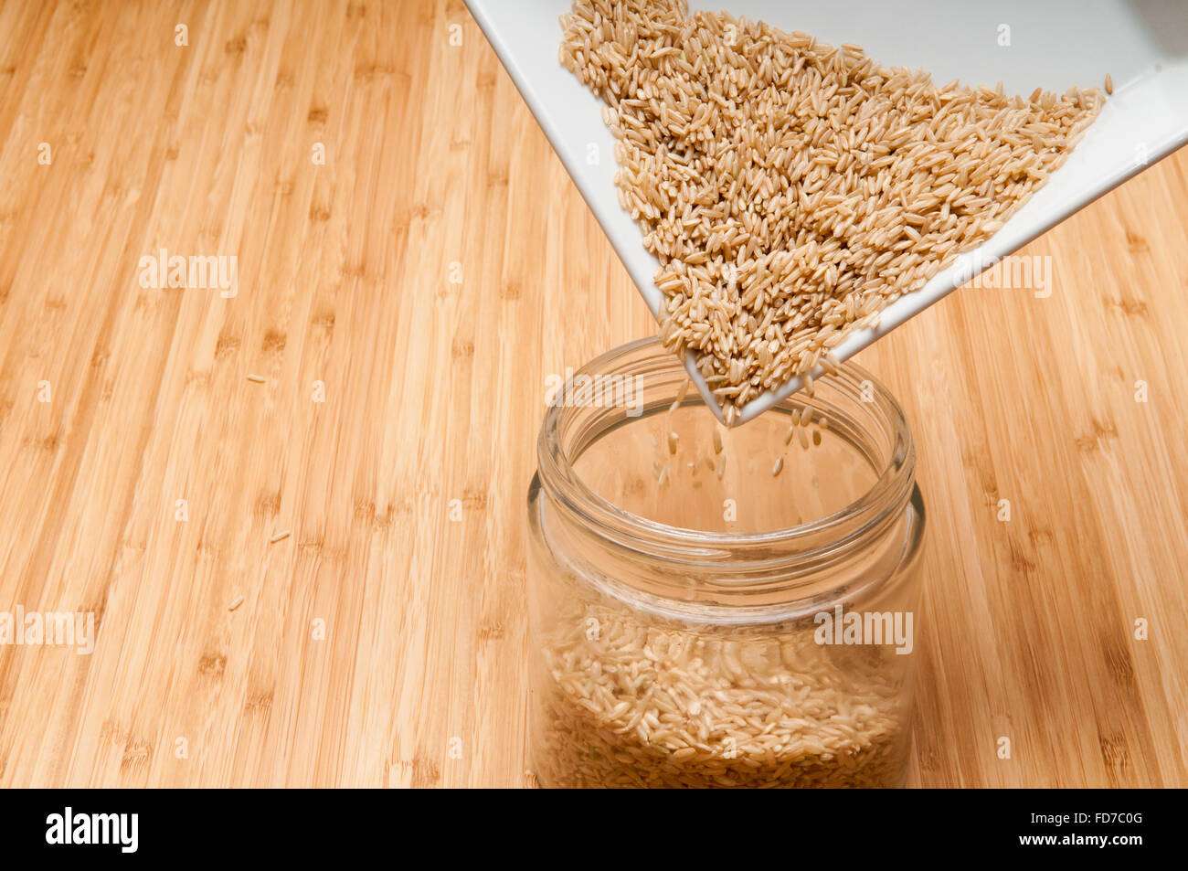 Close up pouring brown rice hi-res stock photography and images - Alamy