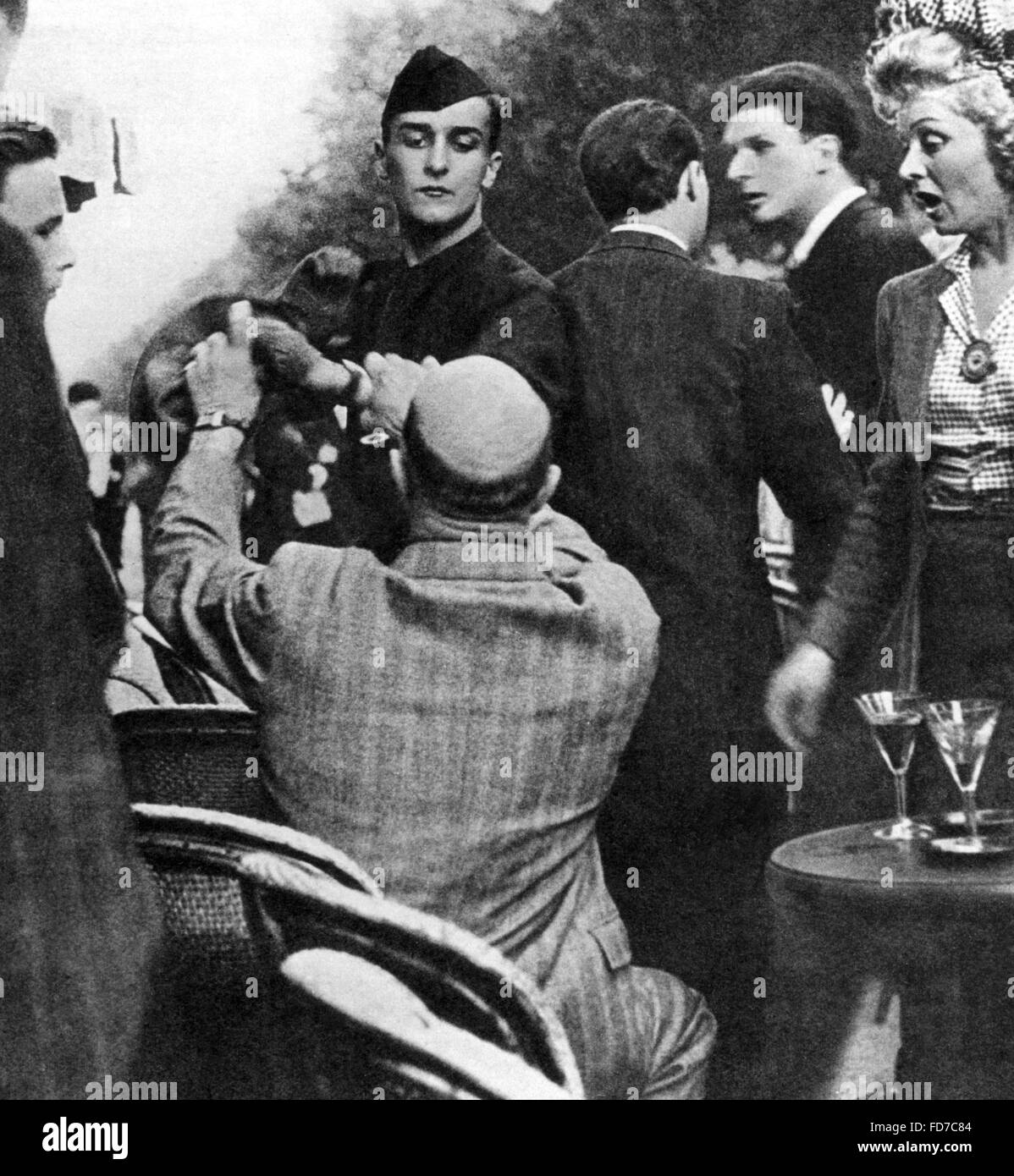 A 'Francist' and a French citizen argueing in Paris, 1943 Stock Photo ...