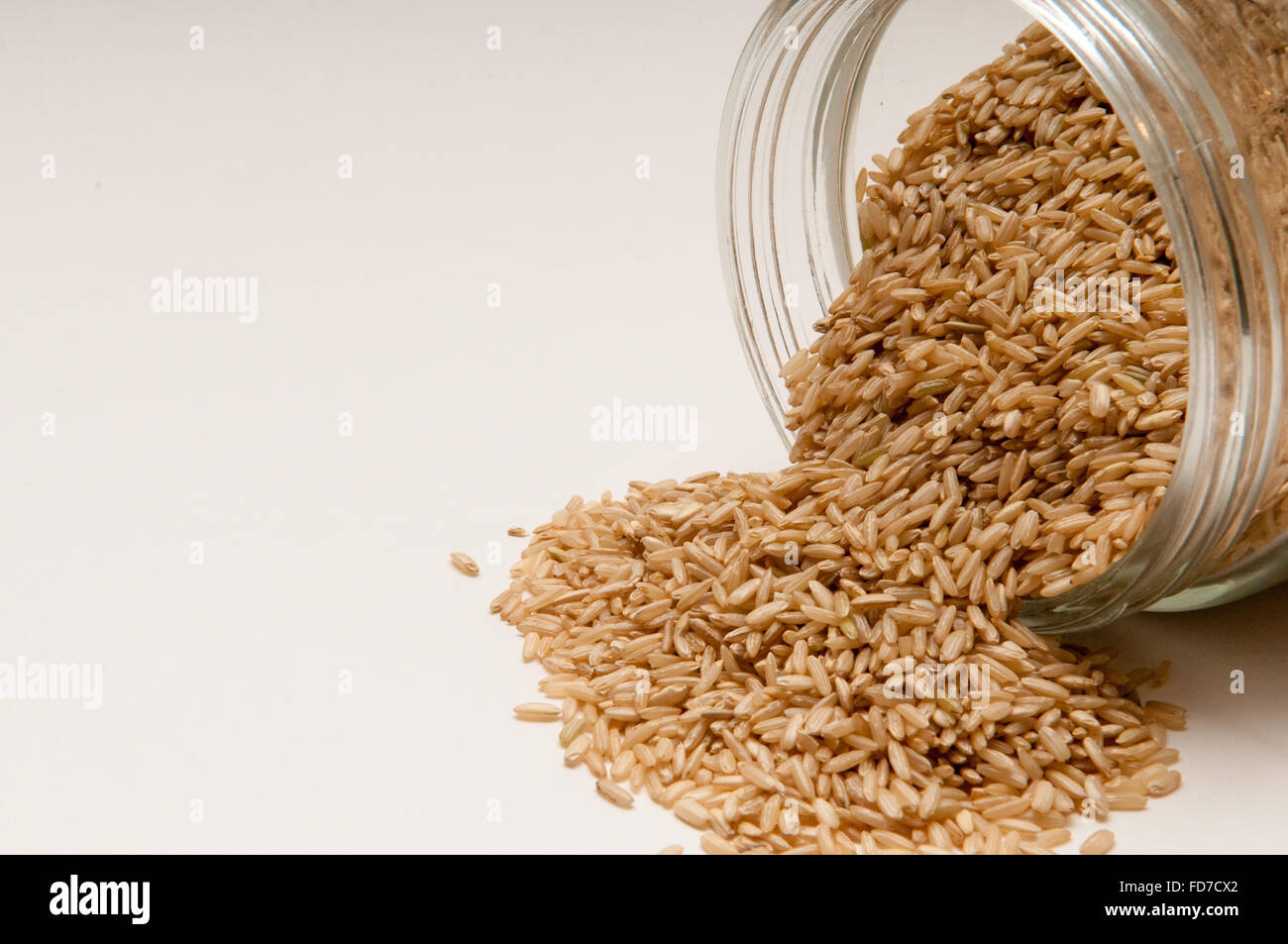 Close up pouring brown rice hi-res stock photography and images - Alamy