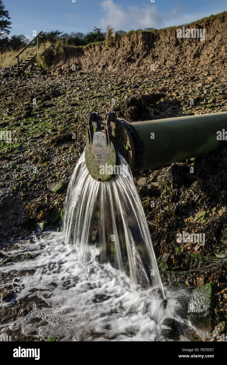 Waste water flows out of an outflow waste water pipe into the river in ...