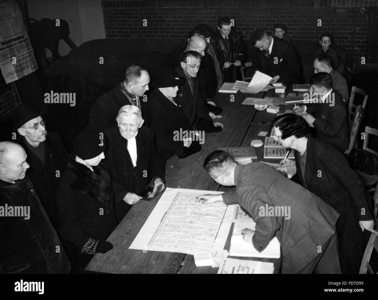 Viewing the electoral list for the Reichstag election 1936 in Berlin ...
