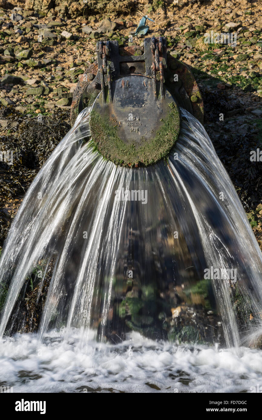 Waste water flows out of an outflow waste water pipe into the river in ...