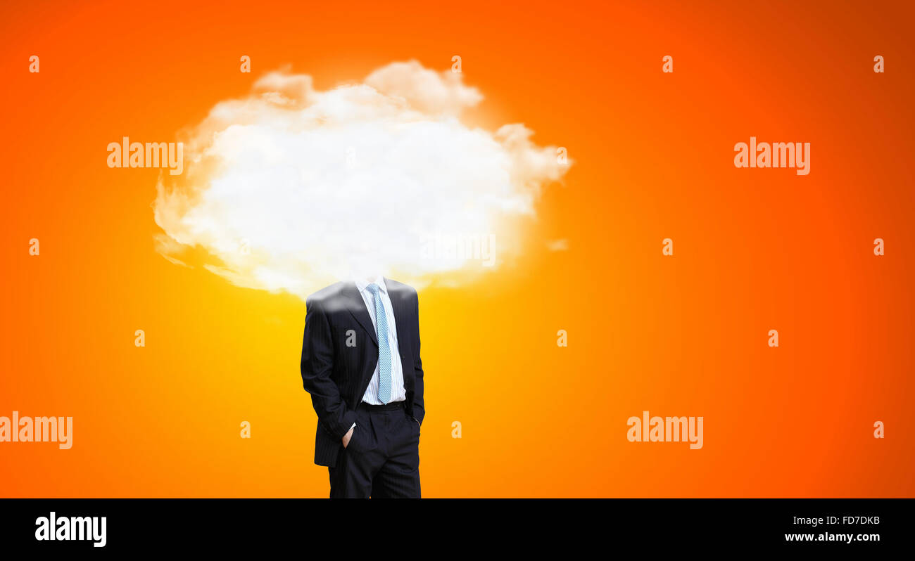 Businessman standing with his head in cloud Stock Photo - Alamy