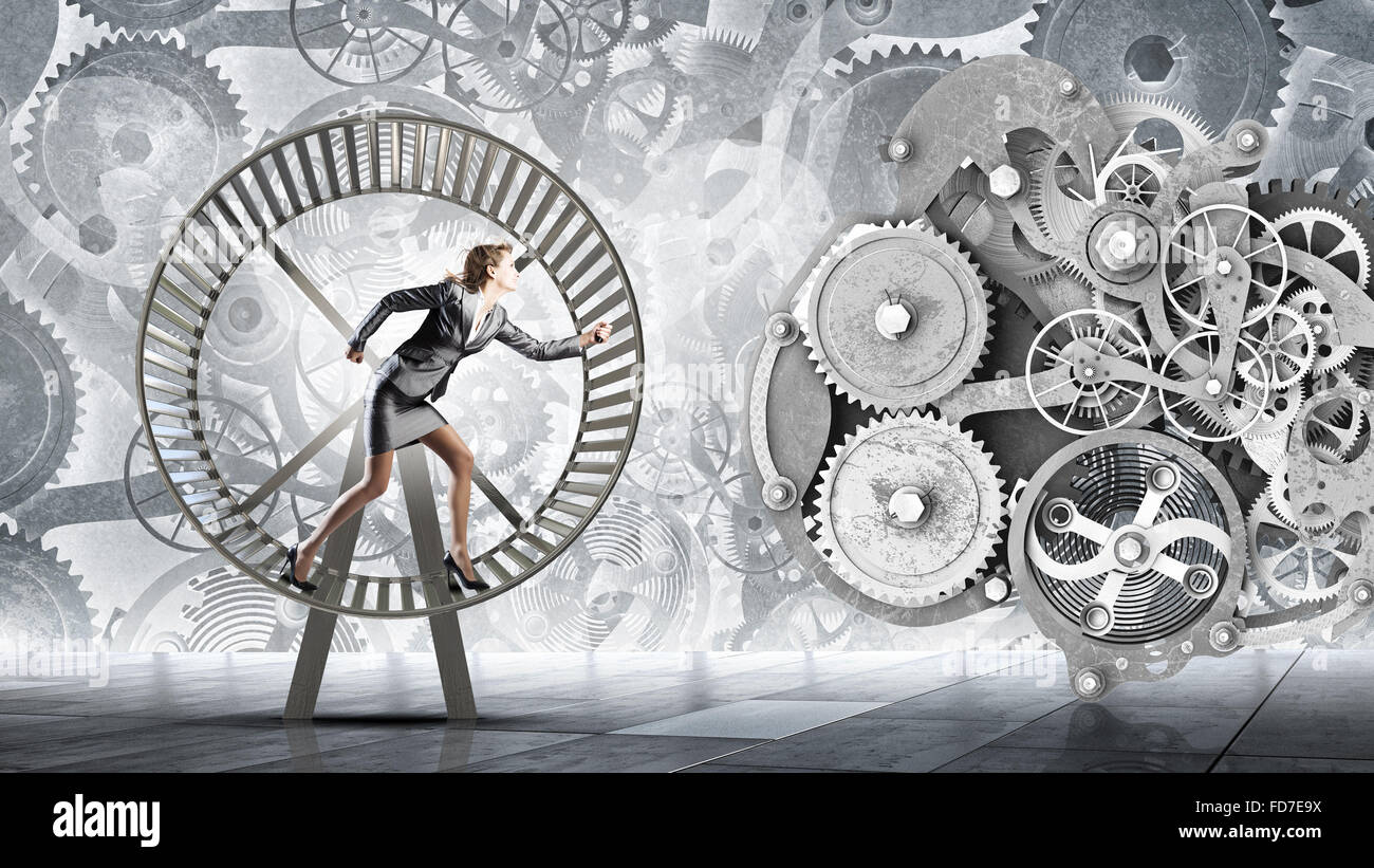 Young businessman running in wheel of gears mechanism Stock Photo - Alamy