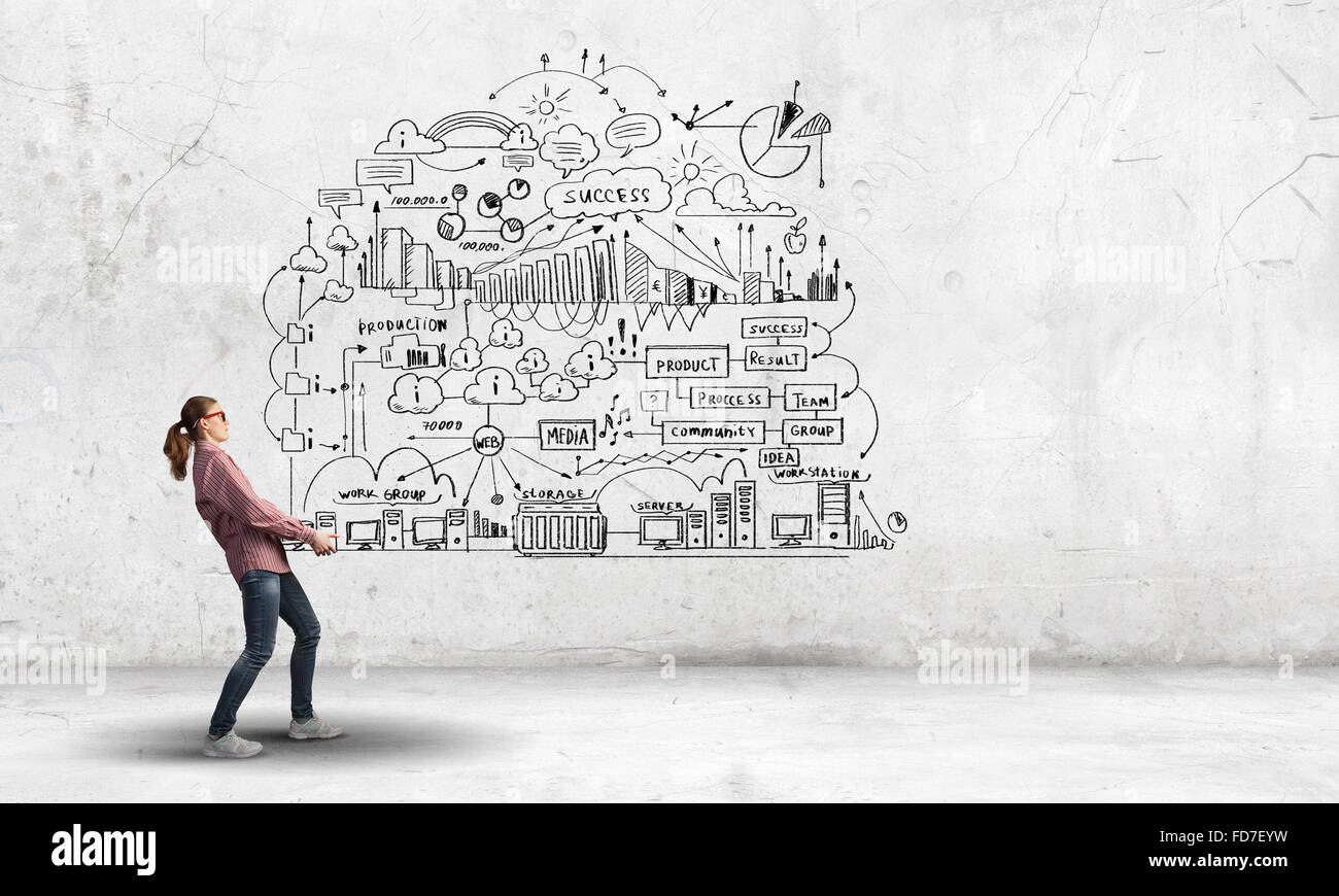 Young woman carrying out ideas of business plan Stock Photo - Alamy