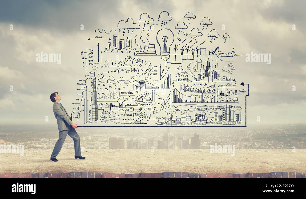 Young businessman carrying out ideas of business plan Stock Photo - Alamy