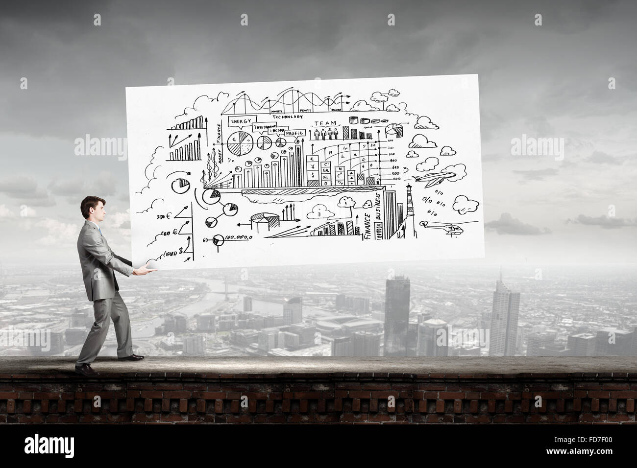 Young businessman carrying out ideas of business plan Stock Photo - Alamy