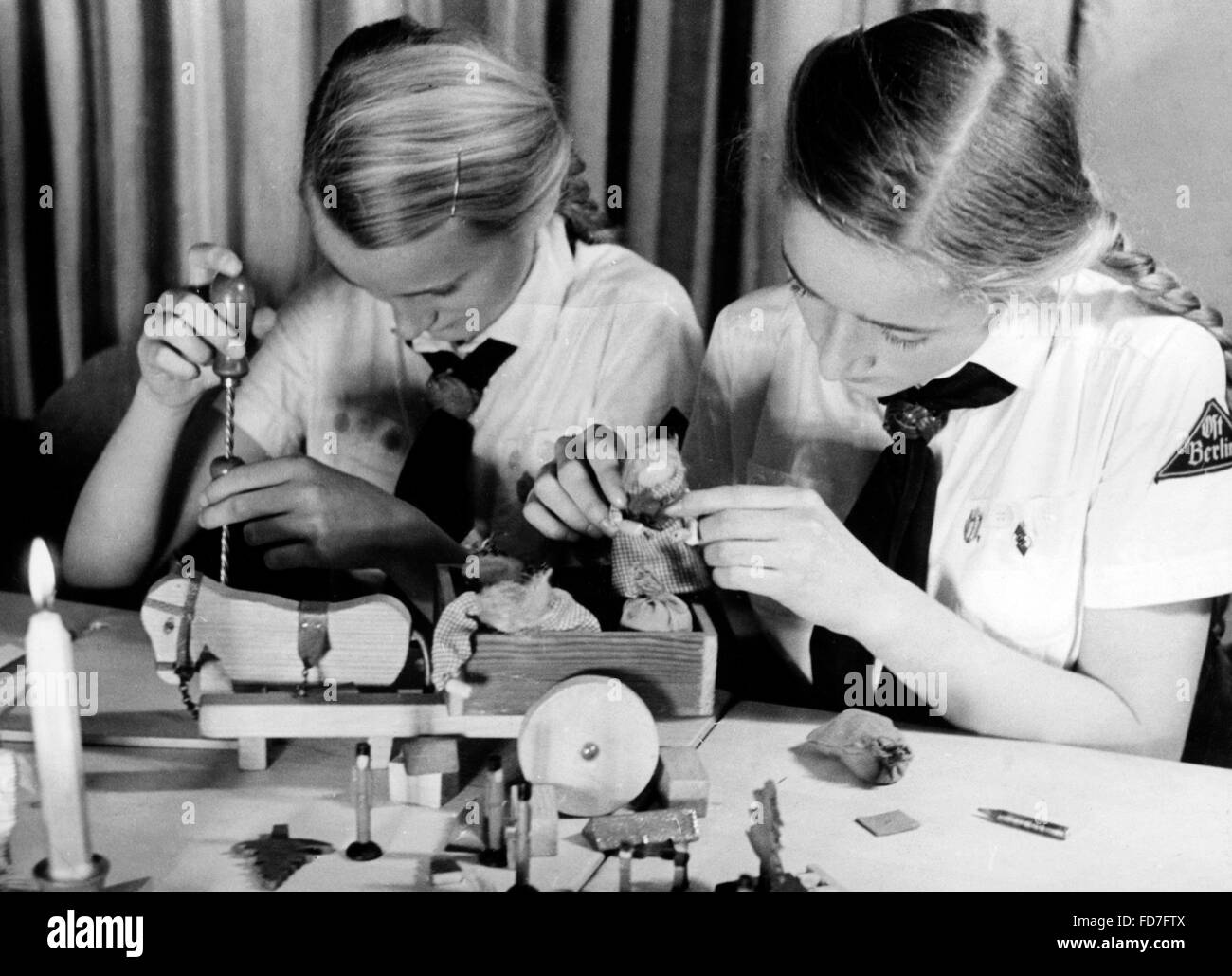 Members of the BDM making wooden toys in Berlin, 1941 Stock Photo - Alamy