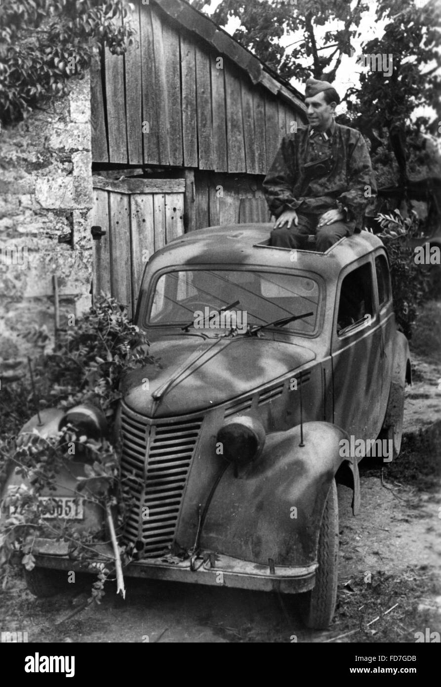 Camouflaged German car in Normandy, 1944 Stock Photo - Alamy