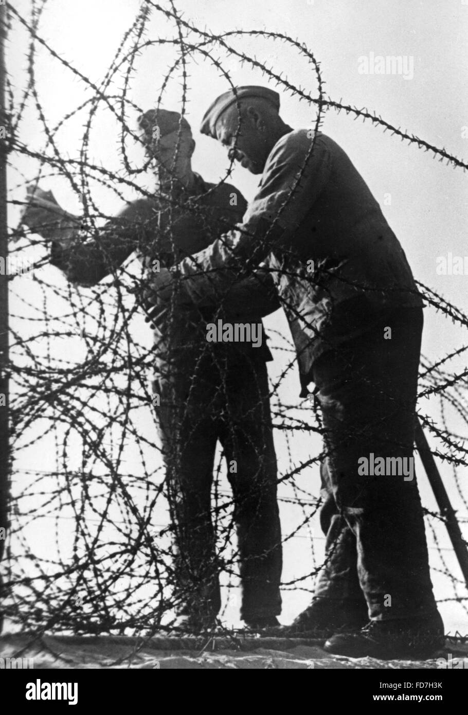 Laying of barbed wire along the Channel coast Stock Photo - Alamy