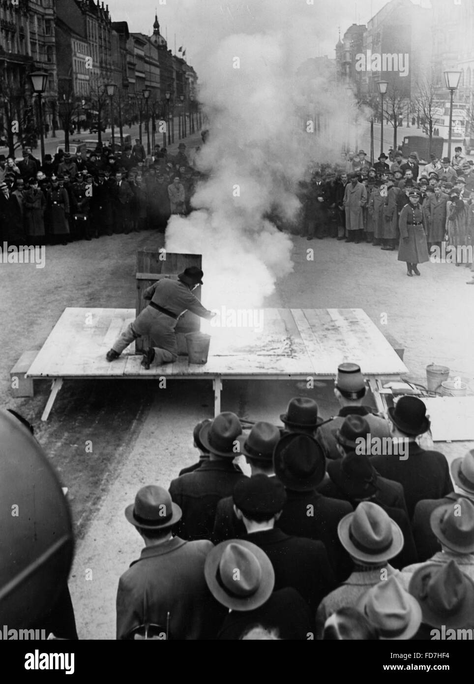 Demonstration of extinguishing firebombs in Berlin, 1941 Stock Photo ...