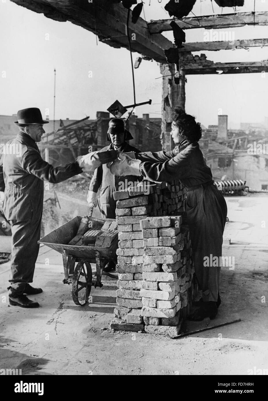 Cleaning up after an air raid, 1944 Stock Photo - Alamy