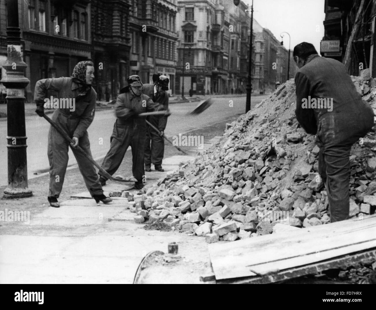 Cleaning up after an air raid, 1944 Stock Photo - Alamy