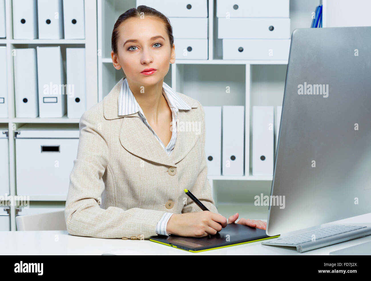 Attractive photo editor working on computer in a modern office Stock ...