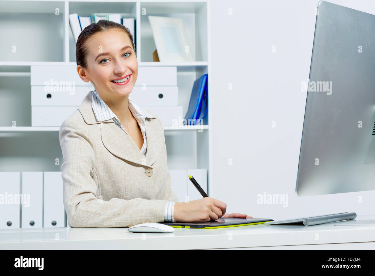 Attractive photo editor working on computer in a modern office Stock ...