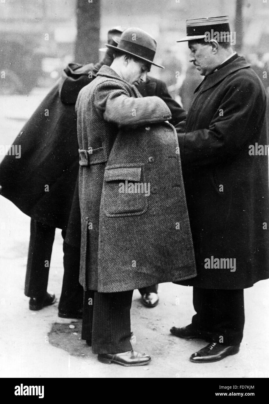Police inspection of pedestrians in Paris, 1934 Stock Photo - Alamy