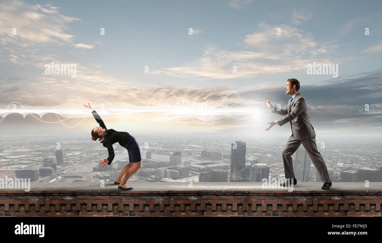 Young businesswoman benting back to evade from fire Stock Photo - Alamy