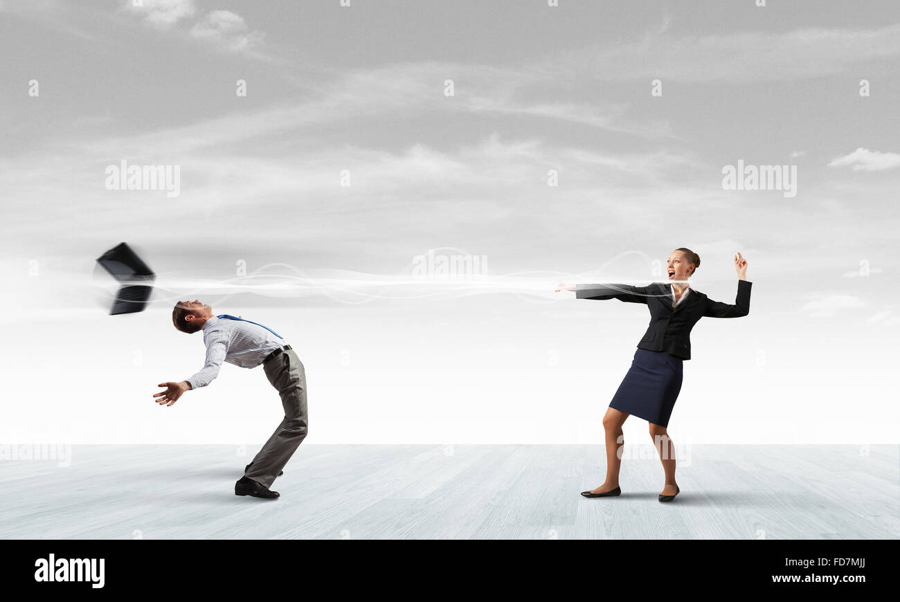 Young businessman trying to evade from thrown laptop Stock Photo - Alamy