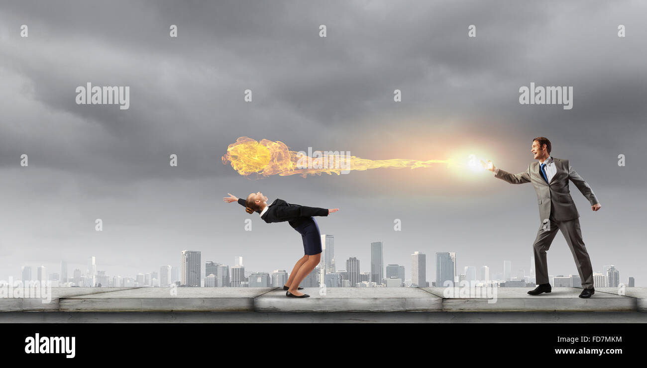 Young businesswoman benting back to evade from fire Stock Photo - Alamy