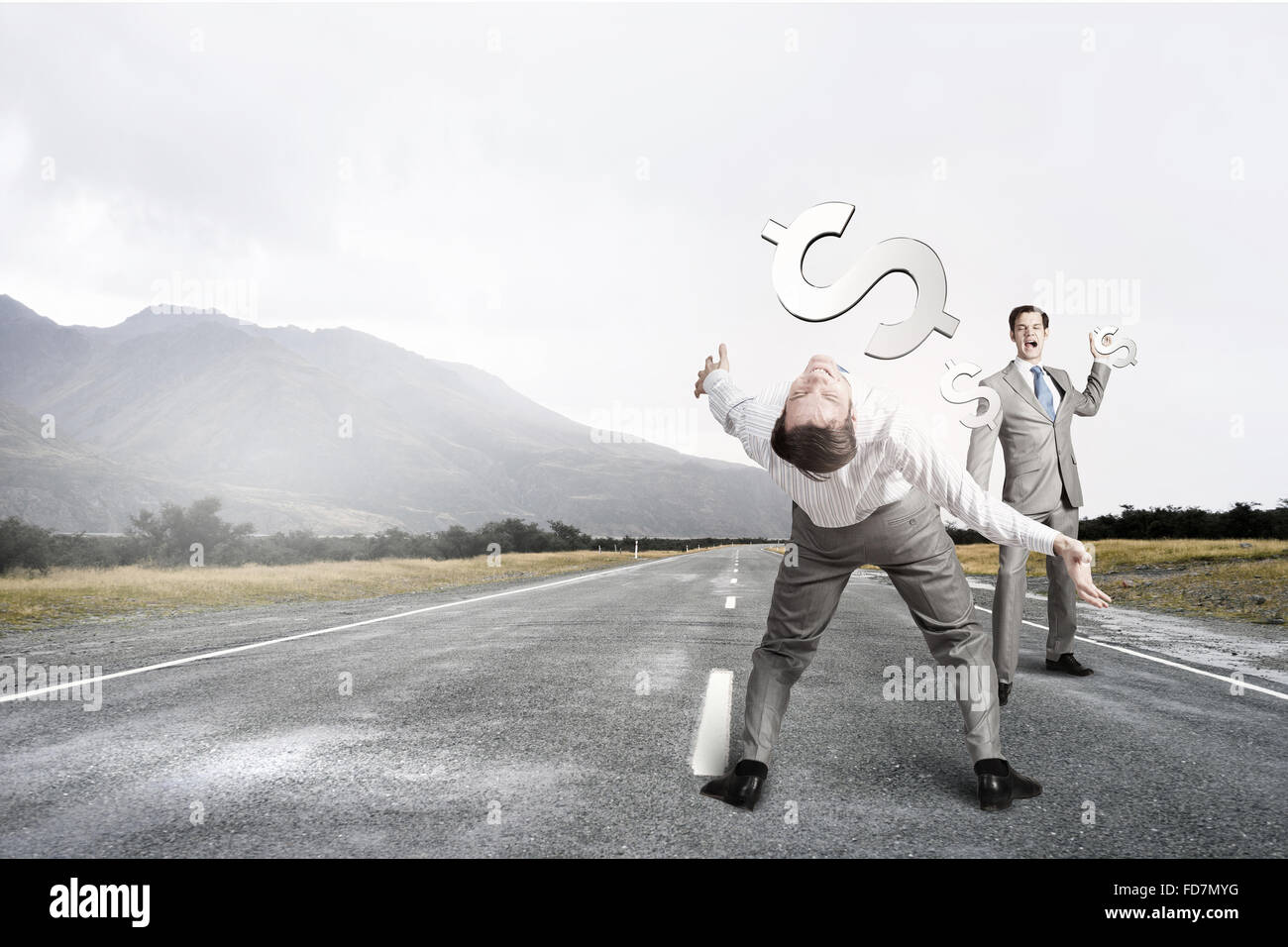Young businessman benting to evade from thrown dollar sign Stock Photo ...
